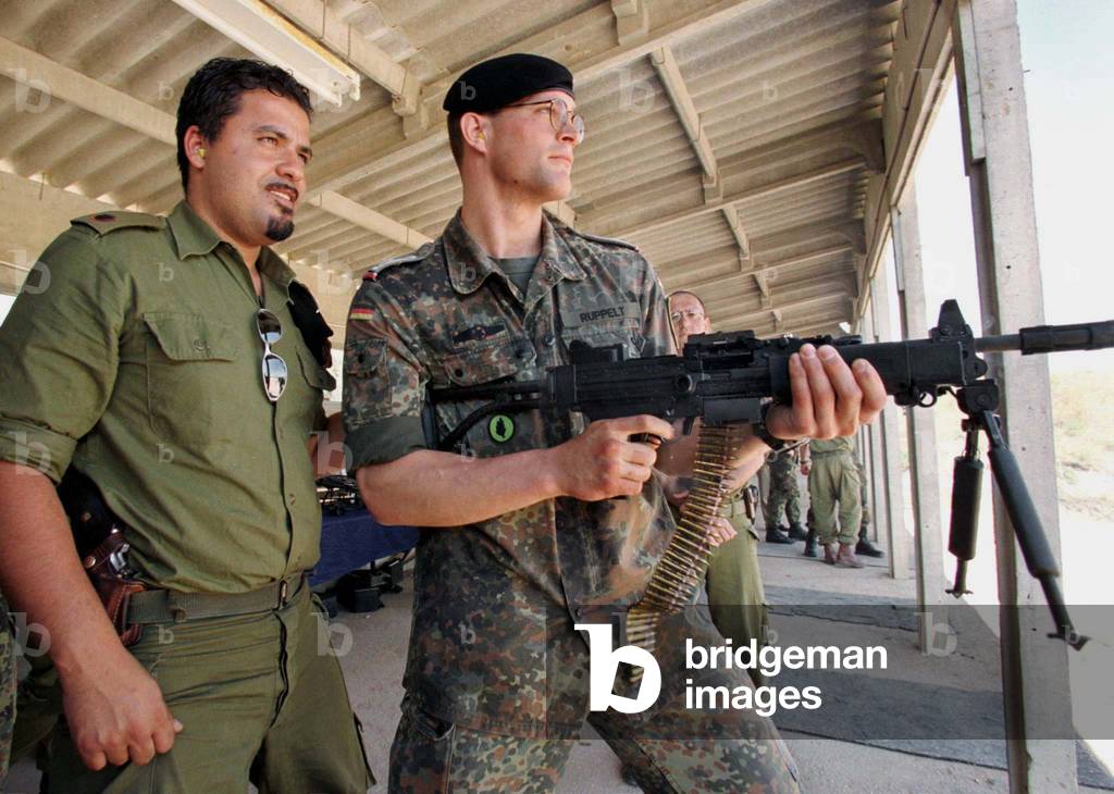 Image of German army officer cadet Ruppelt blazes away with an Israeli-made
