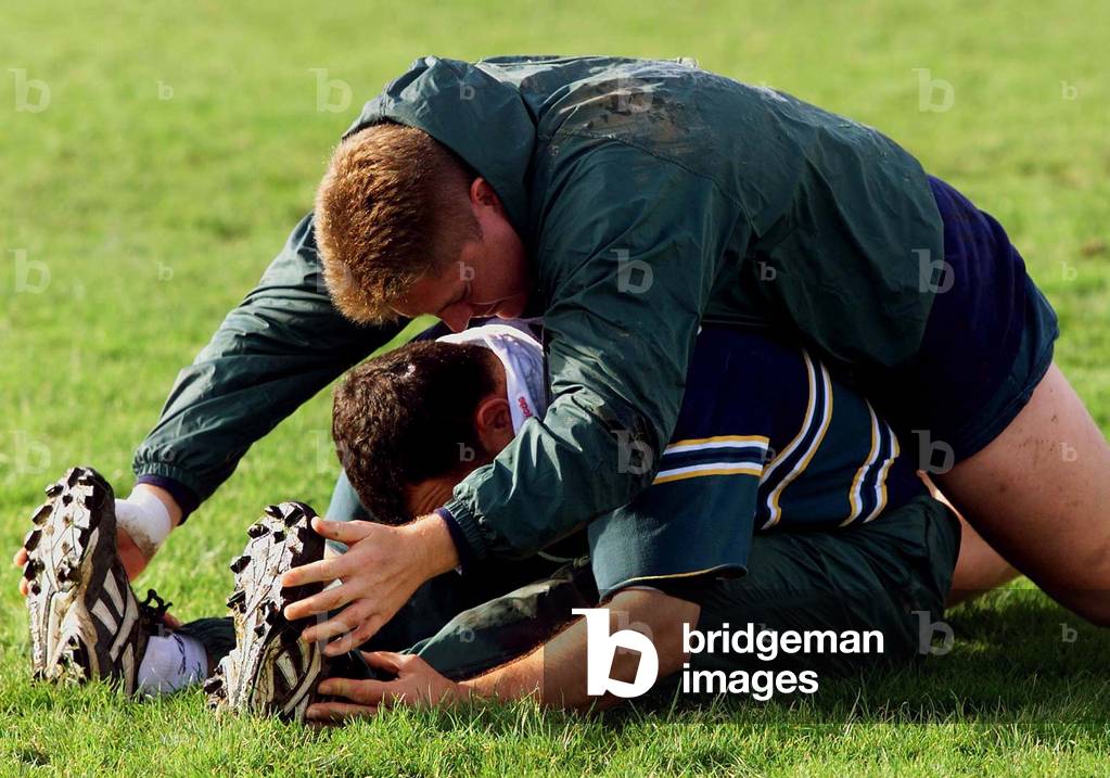 Image of Andrew Blades (R) teams up with Michael Foley for stretching