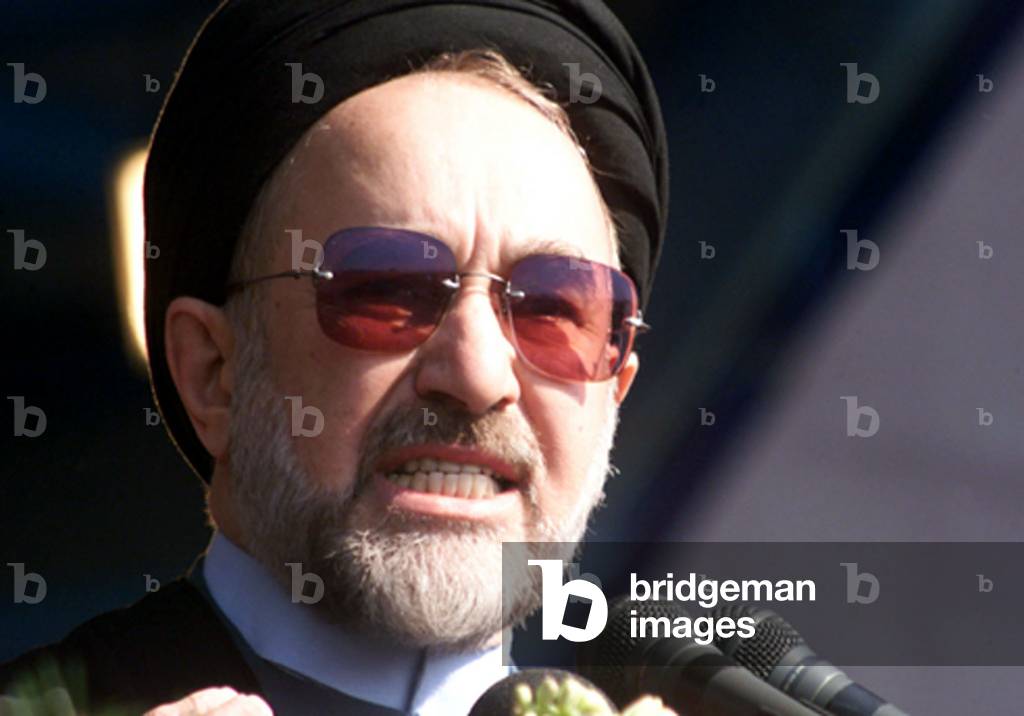 Image of IRANIAN PRESIDENT GESTURES AS ADDRESSES RALLY MARKING 21 YEARS OF