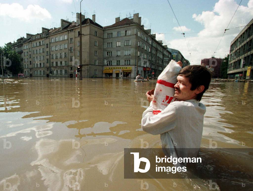 Image of A man holds his bag of food as he tries