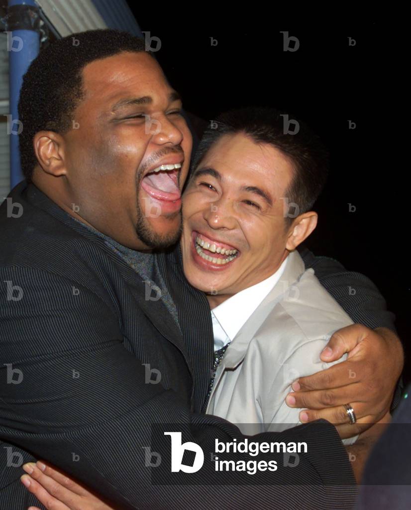Image of Hong Kong action film star Jet Li (R) is greeted