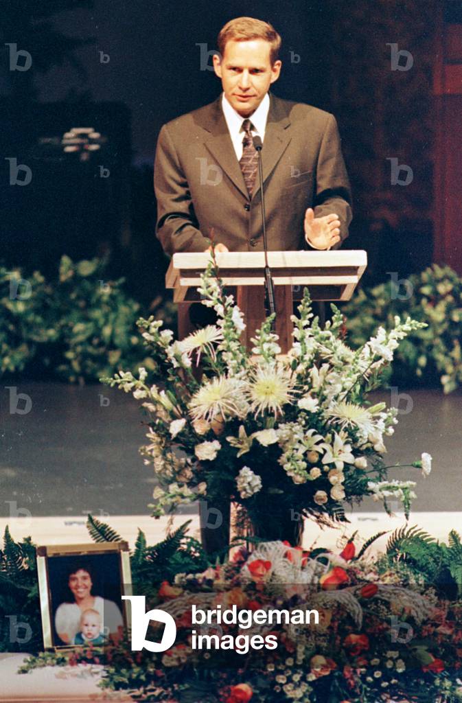 Image of JIM BOWERS REMEMBERS HIS WIFE AND CHILD AT FUNERAL CEREMONIES,