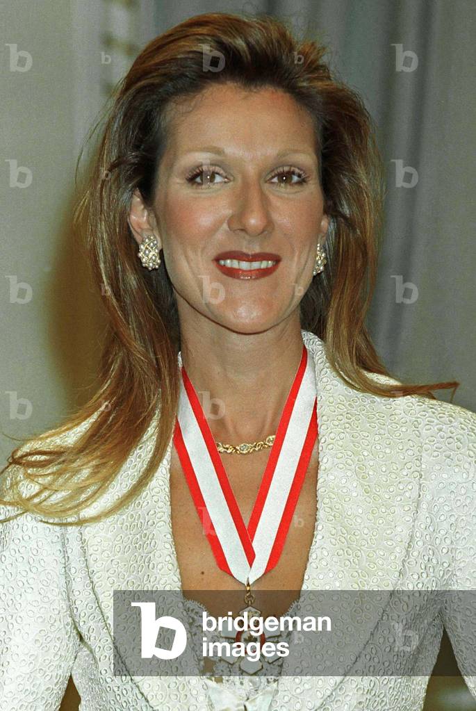 Image of Canadian singer Celine Dion shows her medal of Officer in