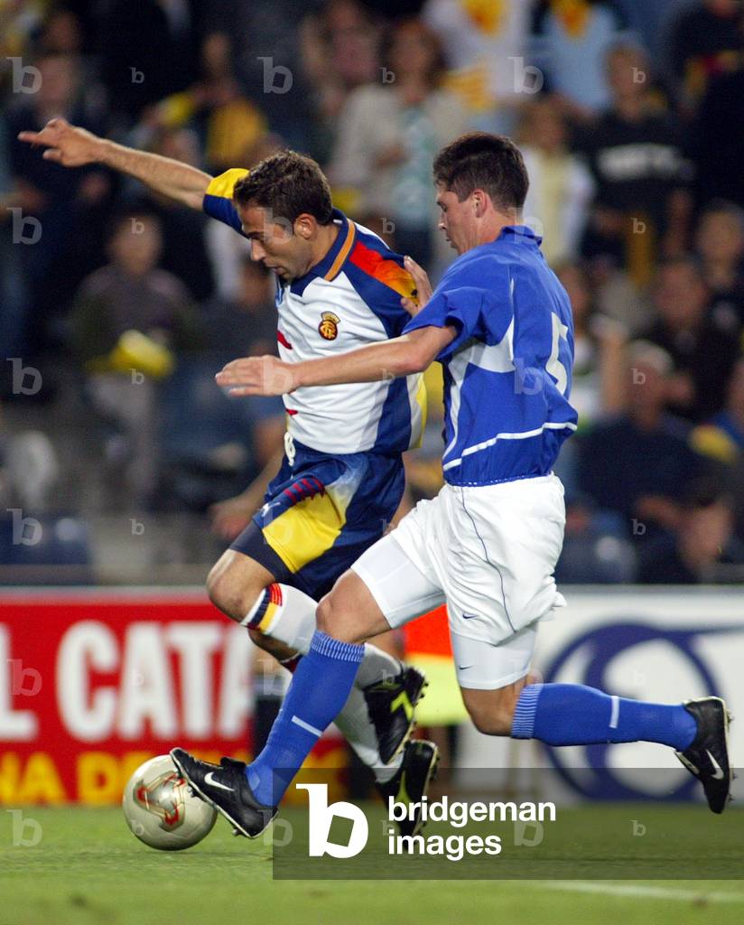 Image of BRAZILIAN DEFENDER ANDERSON POLGA TACKLES MORALES OF CATALUNYA ...