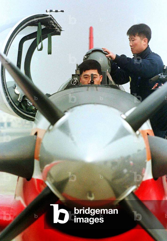 Image of A South Korean Air Force ground crew chief (R) fits