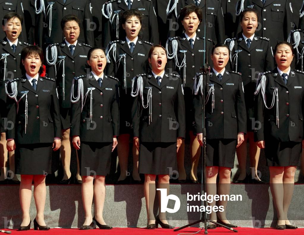 Image of Chinese police officers sing during an open day of the