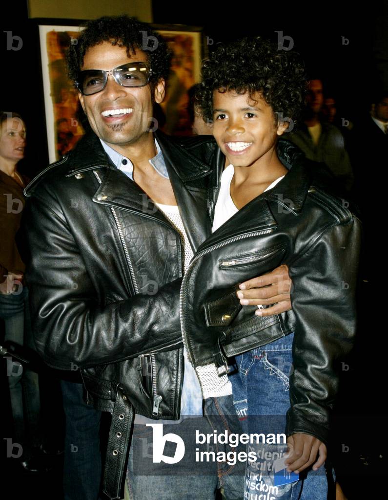 Image of Actor Mario Van Peebles and his son Mandela pose as