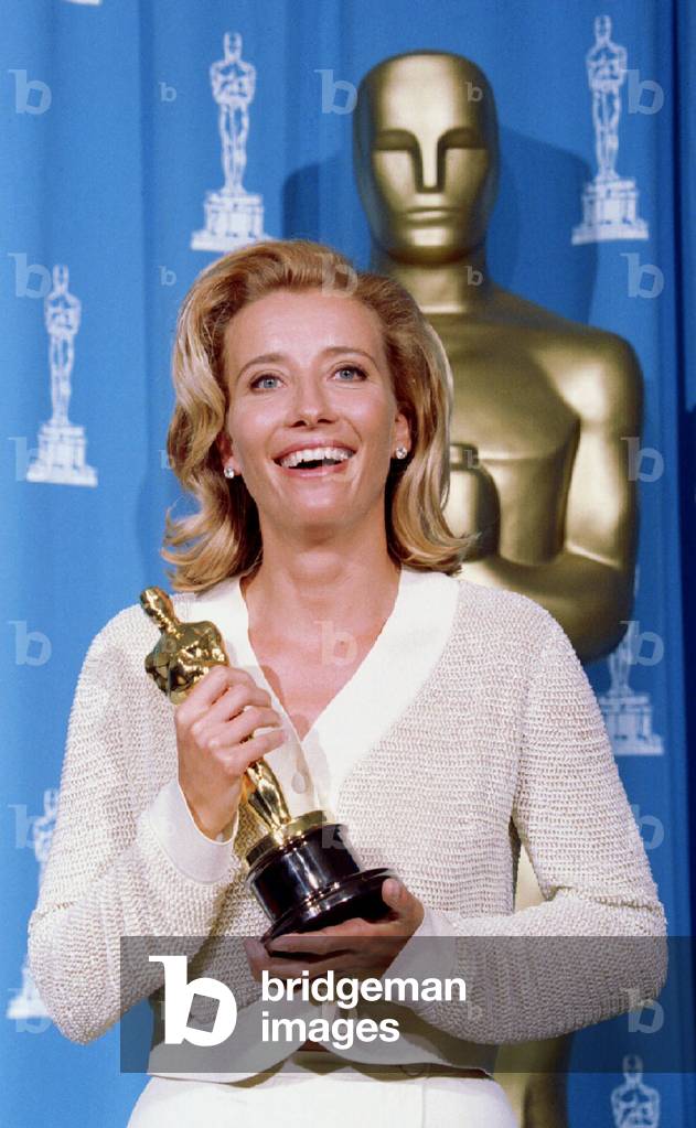 Image of Actress Emma Thompson holds her Oscar awarded to her for