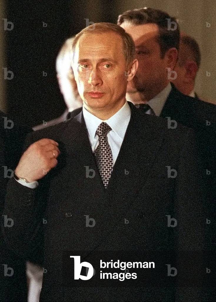 Image of Russian President-elect Vladimir Putin makes a sign of the cross