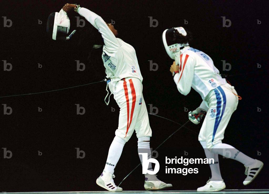 Image of FRENCH FENCER CELEBRATES GOLD MEDAL VICTORY, 1996 (photo)
