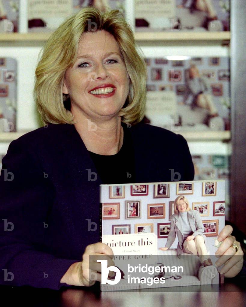 Image of Tipper Gore, wife of Vice President Al-Gore, holds a copy