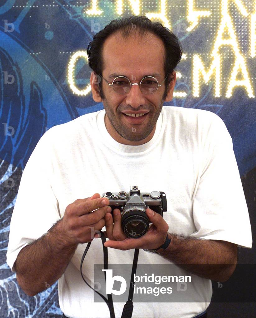Image of Iranian actor Behzad Dourani takes photographs during photo ...