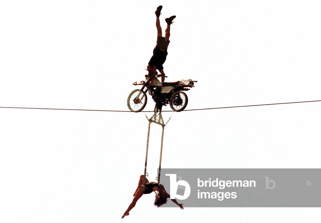 Image of A high-wire trapeze act, called the Flying Lotahs, practise their