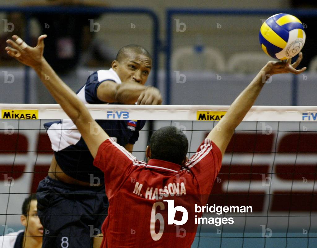 Image of VENEZUELAN MANZANILLO SPIKES THE BALL DURING THE MENS ...
