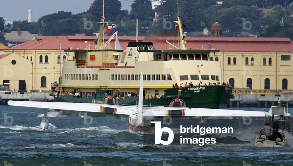 Image of SEAPLANE MAKES WAY UP SYDNEY HARBOUR TOWARDS FERRY DURING FINISH