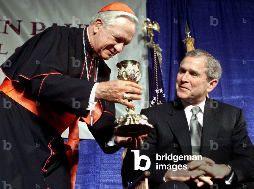 Image of Cardinal Adam Maida shows U.S. President George W. Bush a
