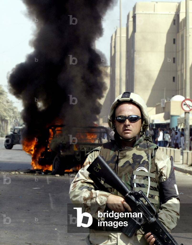 Image of A U.S ARMY MILITARY POLICEMAN SECURES THE AREA AFTER A