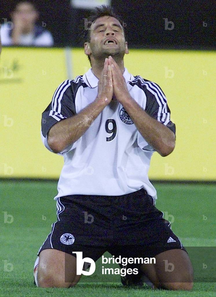 Image of German national soccer team forward Ulf Kirsten reacts after he