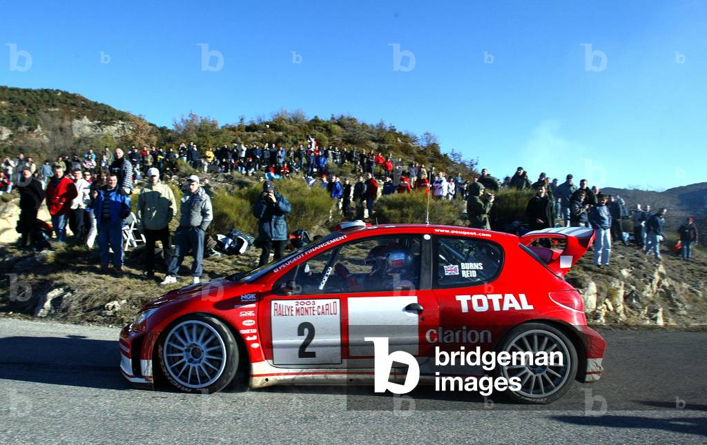 Image of British rally driver Richard Burns drives his Peugeot 206 WRC