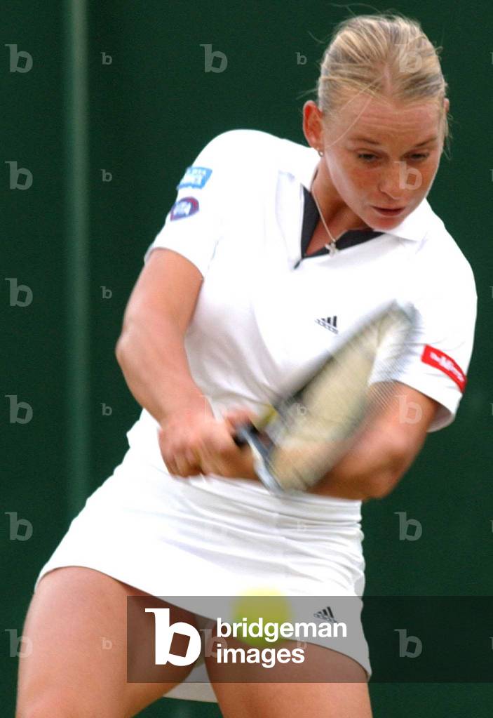 Image of BARBARA SCHETT RETURNS A SERVE AT THE WIMBLEDON CHAMPIONSHIPS ...