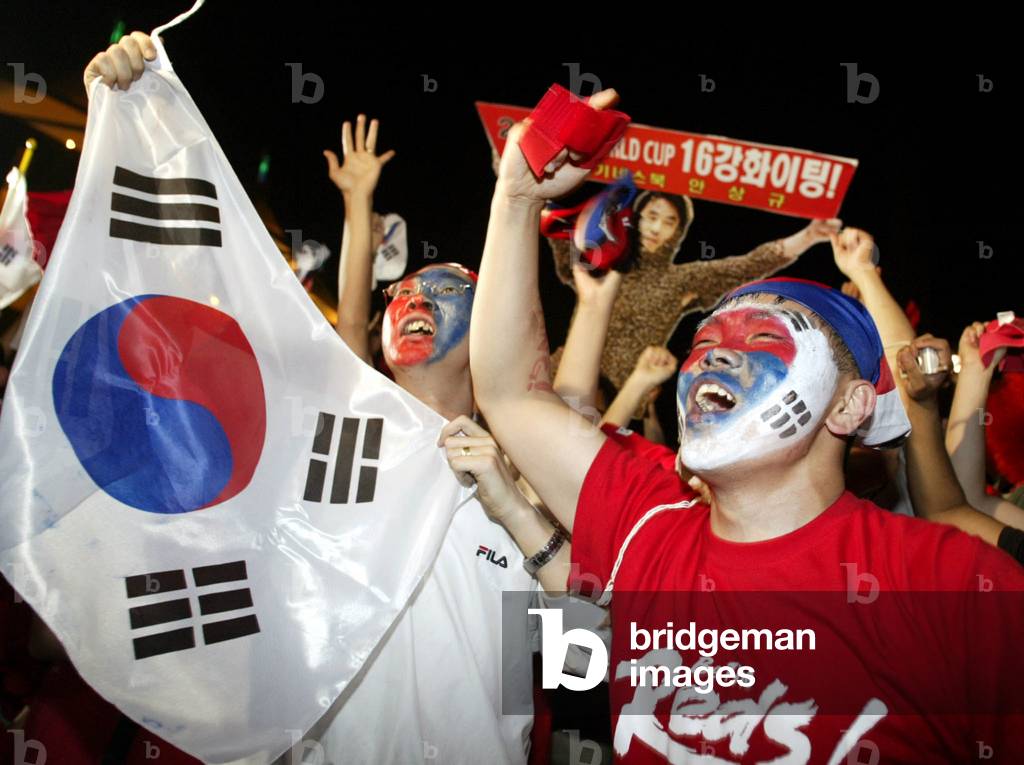 Image of SOUTH KOREAN SOCCER FANS CELEBRATE SOUTH KOREA'S WIN OVER PORTUGAL