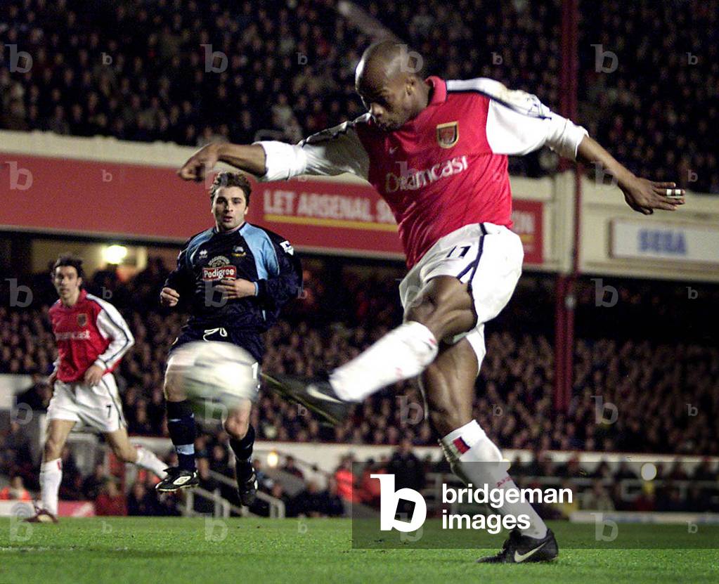 Image of ARSENAL'S WILTORD KICKS THE BALL IN FRONT OF DERBY COUNTY'S