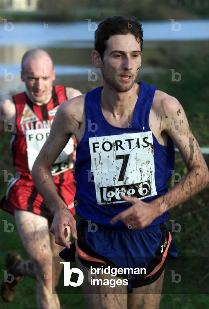 Image of Belgian Jerry Van Den Eede (R) leads the 10,000 m