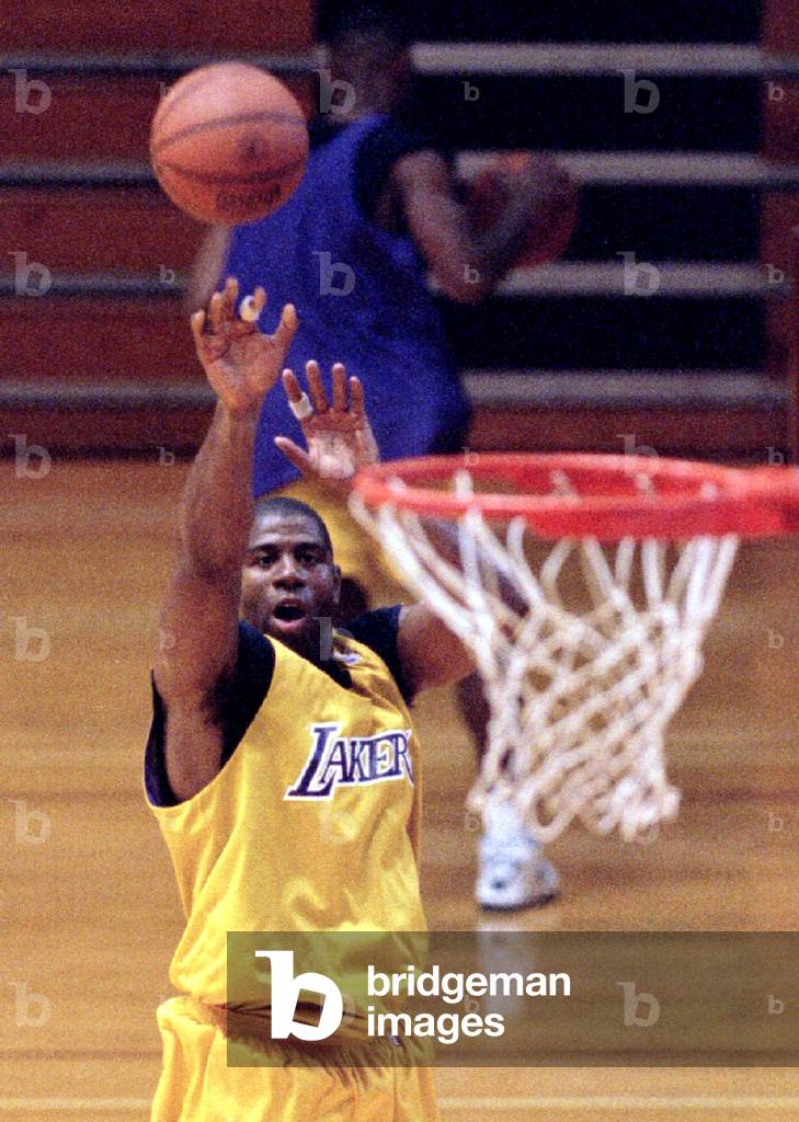 Image of Earvin "Magic" Johnson shoots during a January 29 workout with