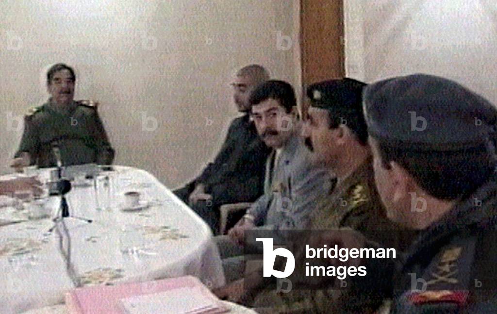 Image of IRAQI PRESIDENT SADDAM HUSSEIN WITH HIS TWO SONS UDAY AND