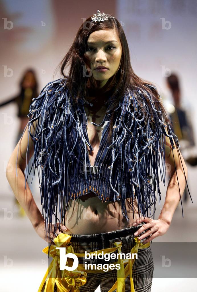 Image of A model wears outfit by Chinese student designer Cao Ran