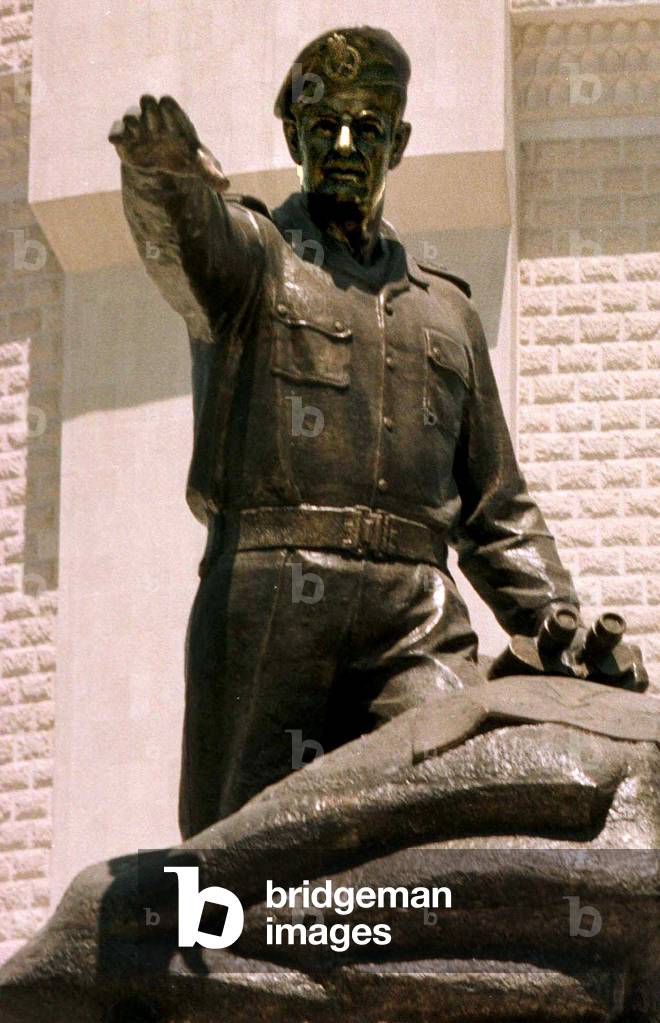 Image of A statue of Syrian President Hafez al-Assad in military uniform