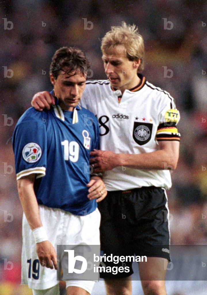 Image of Germany's Juergen Klinsmann consoles Enrico Chiesa at the end of