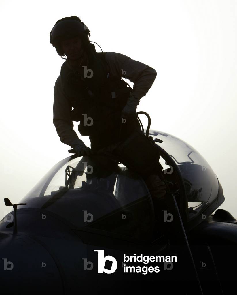 Image of ROYAL AIR FORCE PILOT MAJOR JOE WILLIAMS CLIMBS FROM THE