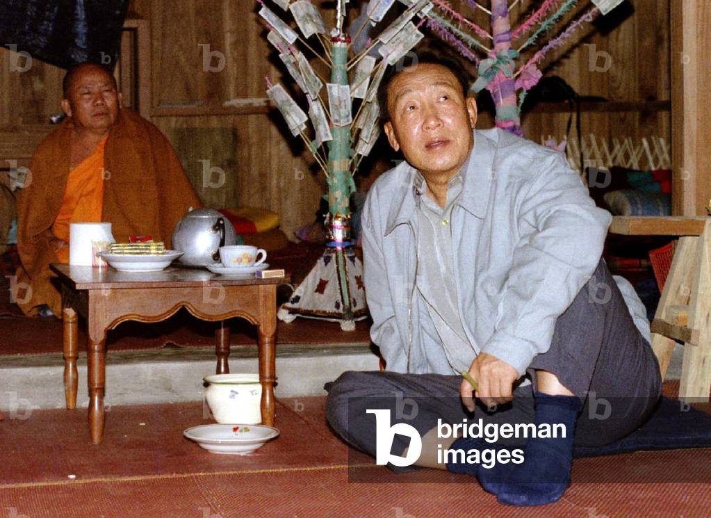 Image of Burma's Golden Triangle opium warlord Khun Sa sits at a