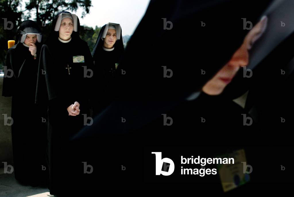 Image of NUNS WAIT OUTSIDE THE DIVINE MERCY SANCTUARY CHURCH FOR ITS ...