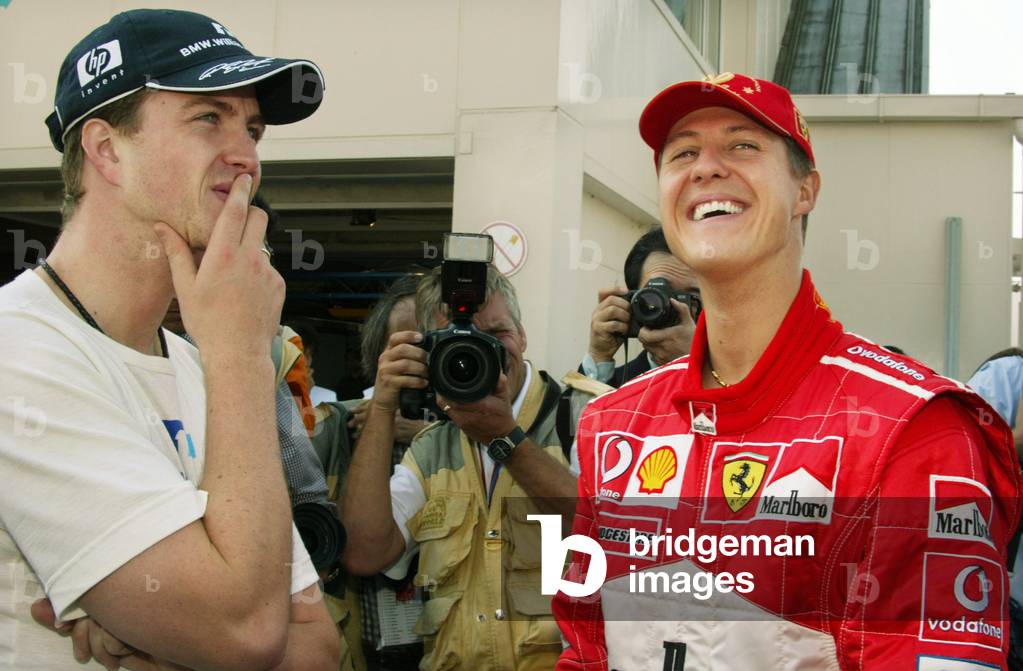 Image of GERMAN MICHAEL SCHUMACHER WITH BROTHER RALF BEFORE START OF F1