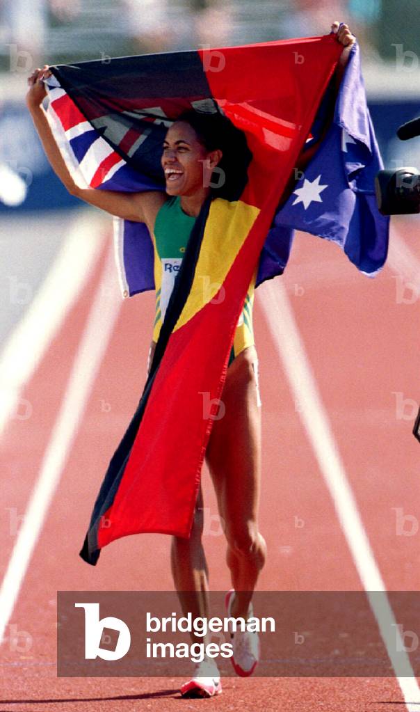 Image of Australian aboriginal athlete Cathy Freeman carries the ...