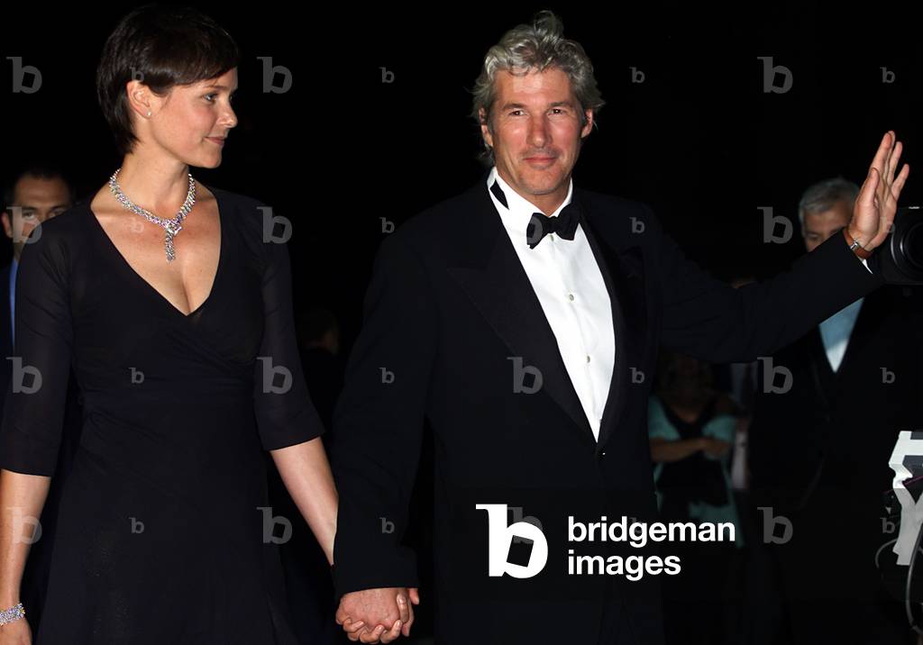 Image of American actor Richard Gere poses with his wife Carey at