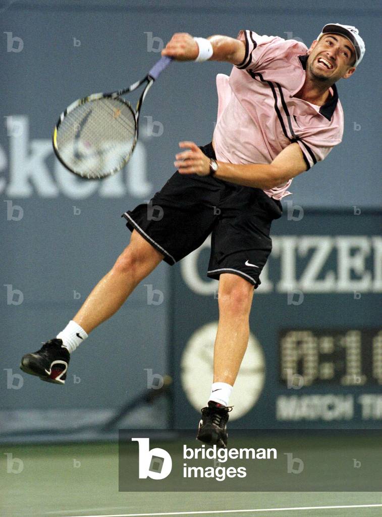 Andre Agassi Quote Image Of ANDRE AGASSI LEAPS FOR A SHOT DURING