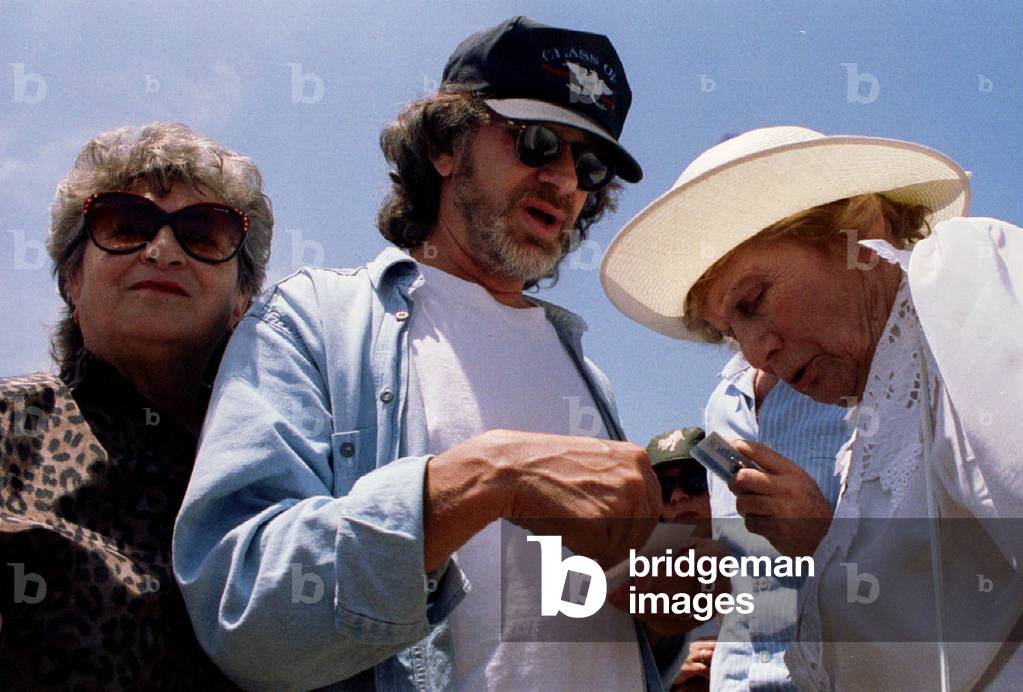 Image of Film director Steven Spielberg signs autographs May 28 as filming