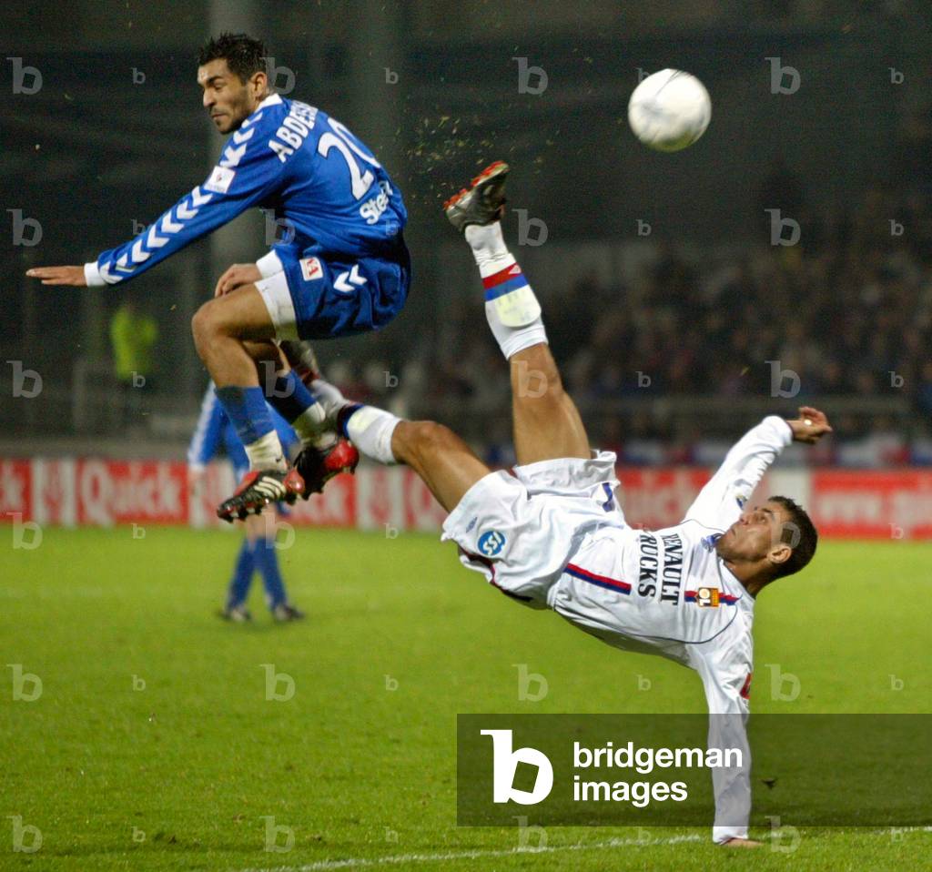 Image of BRYAN BERGOUGNOUX OF LYON CHALLENGES YACINE ABDESSADKI OF ...
