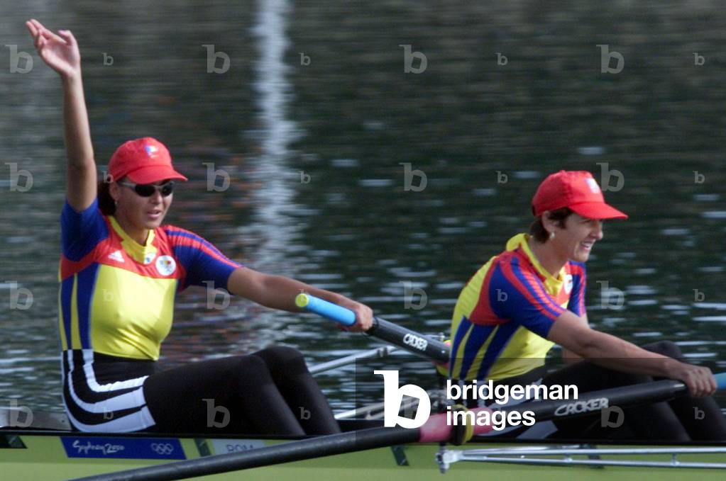 Image of GOLD MEDALIST GEORGETA DAMIAN WAVES WITH DOINA IGNAT OF ROMANIA,