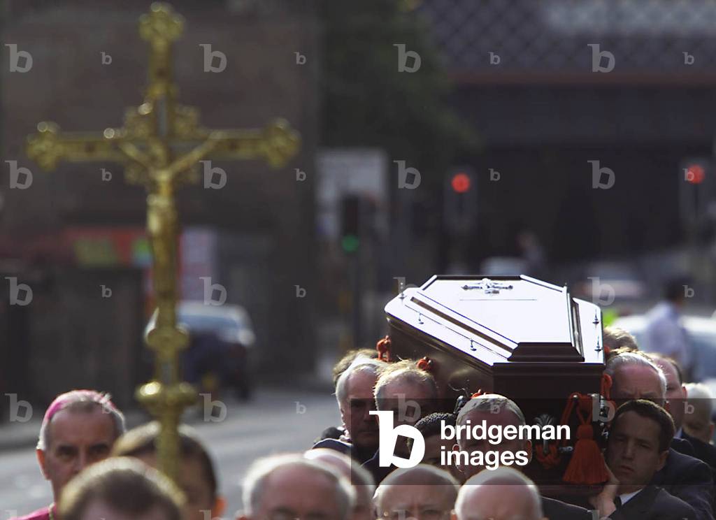 Image of THE COFFIN OF CARDINAL THOMAS WINNING IS CARRIED INTO ST