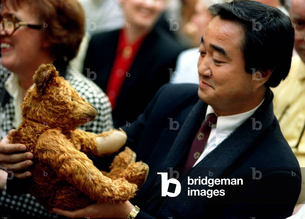 Image of Yoshihiro Sekiguchi of Japan holds "Teddy Girl" which he brought