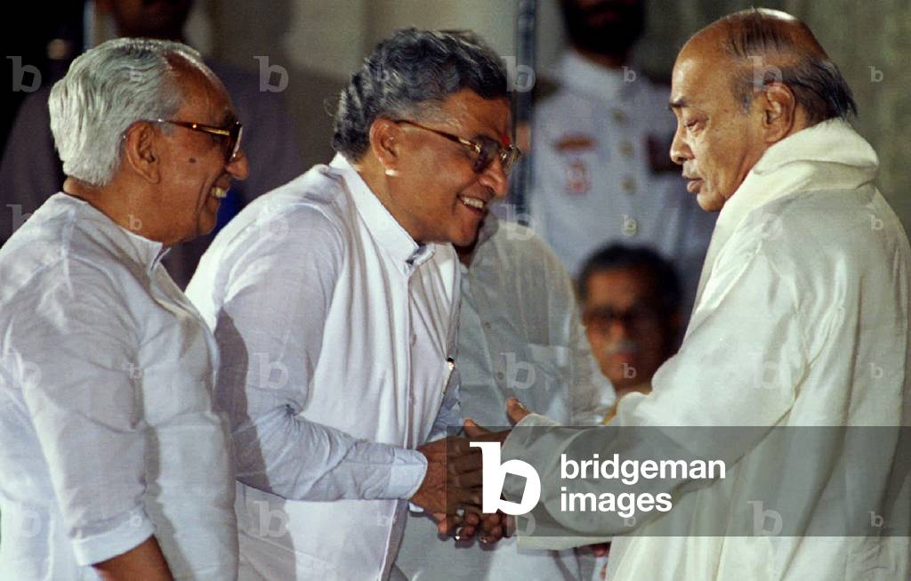 Image of Indian Prime Minister P.V.Narasimha Rao (R) is greeted by Jagannath