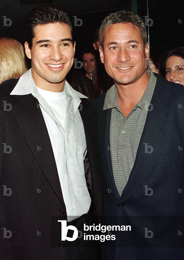 Image of Four-time Olympic Gold medalist Greg Louganis (R) poses with actor