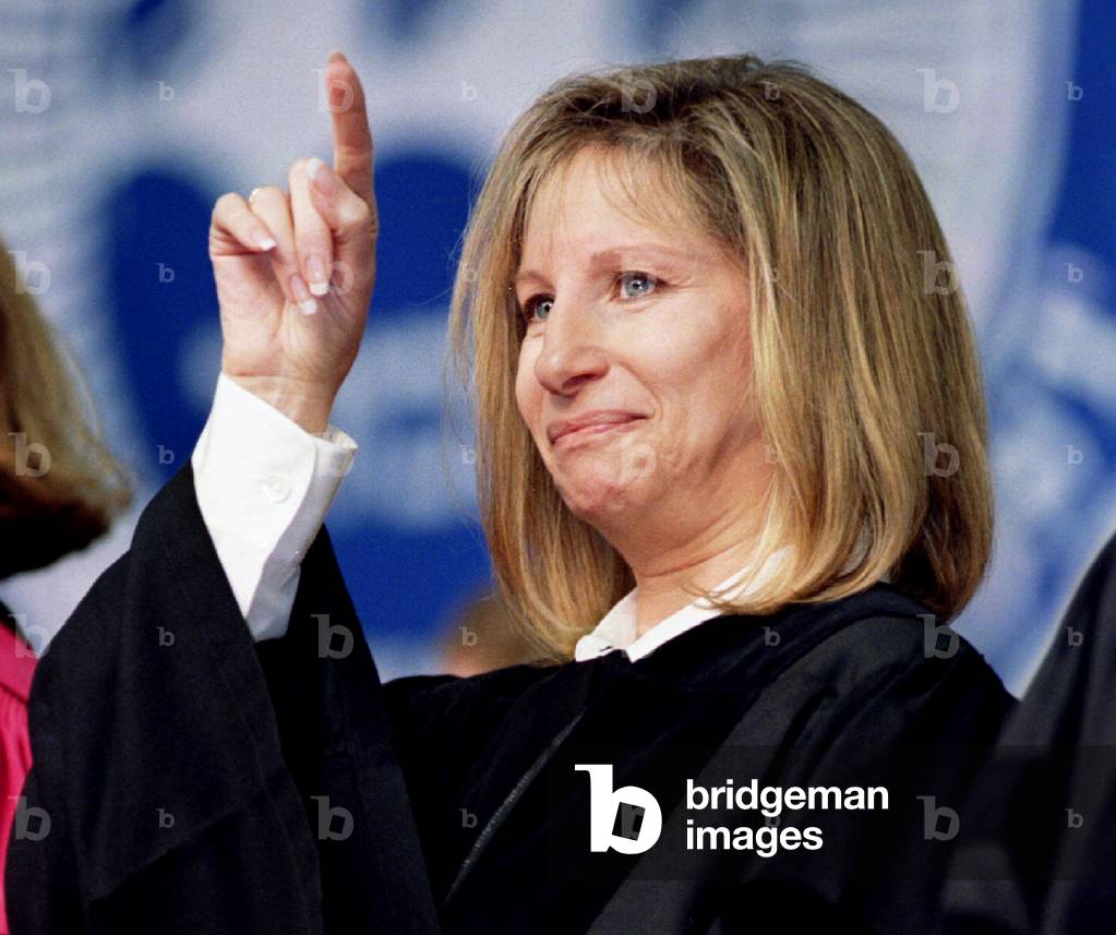Image of Singer and entertainer Barbra Streisand gives a one finger wave