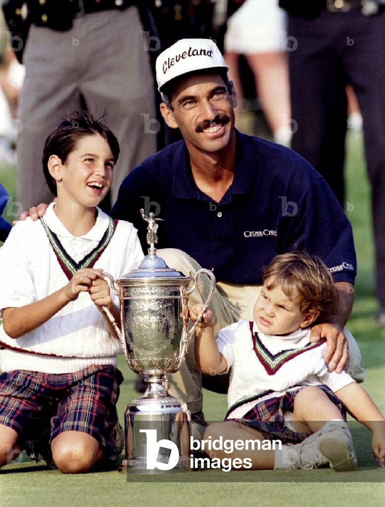 Image of Corey Pavin of the U.S. poses with the trophy and