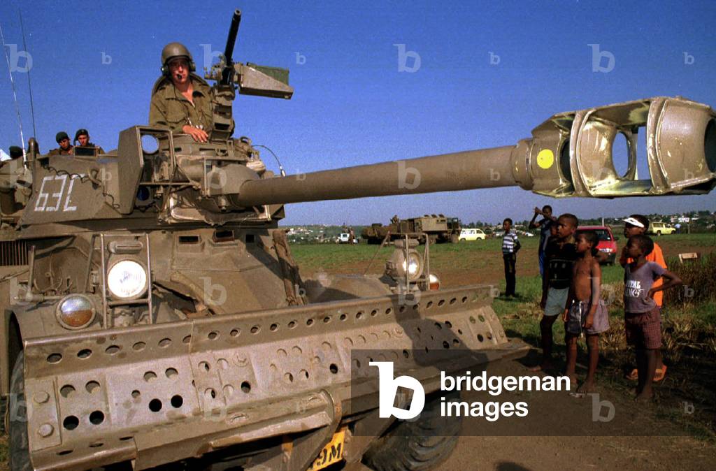 Image of A group of children look at a SADF (South African