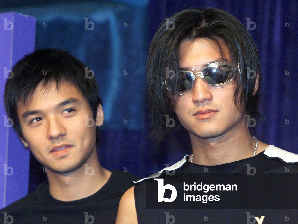 Image of Hong Kong rising star Nicholas Tse (R) and actor Stephen